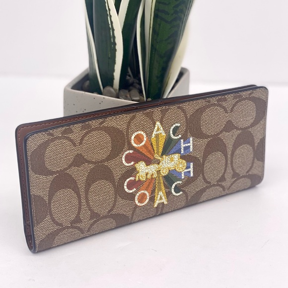 Coach | Bags | Coach Slim Wallet In Signature Canvas With Coach Radial ...